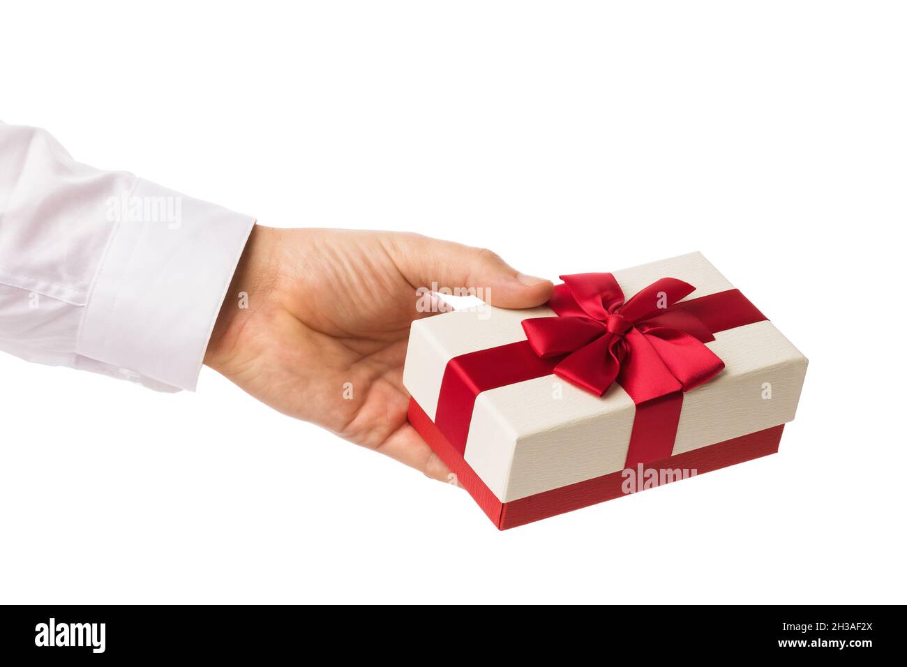 Man's hand holding a box with a gift, isolated on white background ...