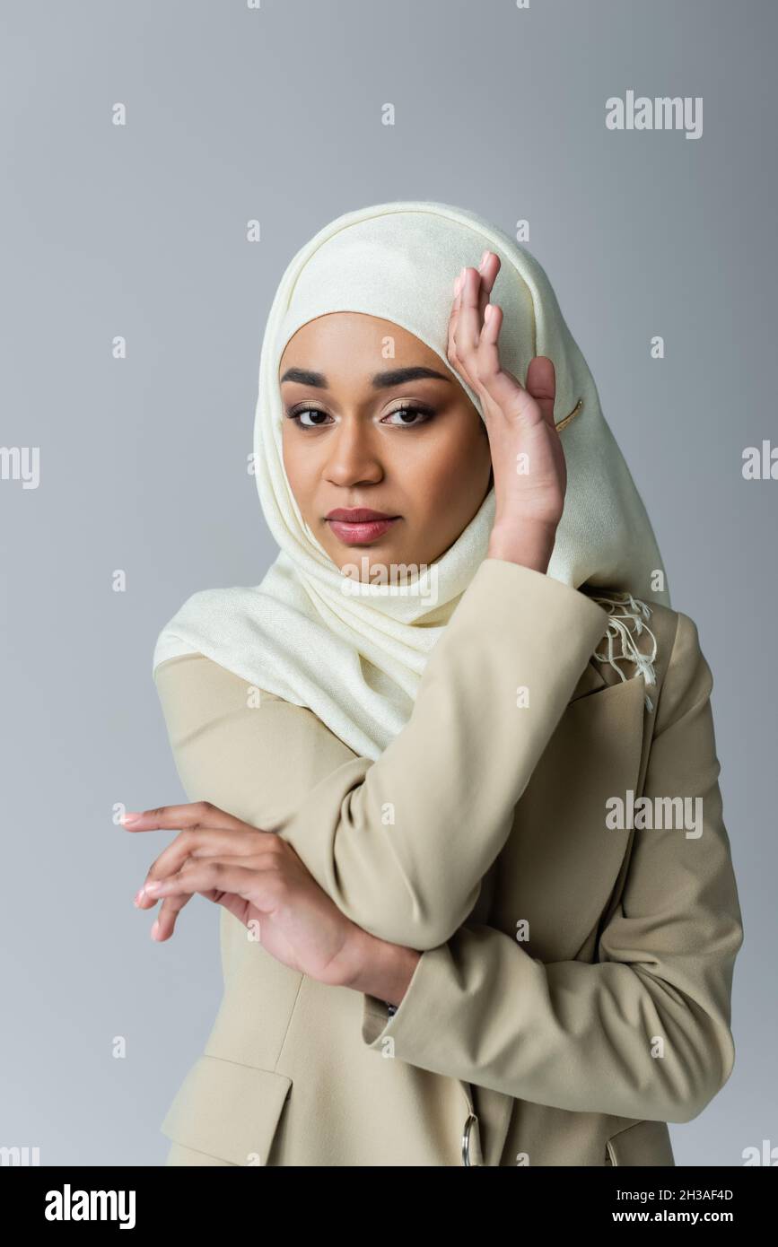 Portrait of muslim woman in hijab looking at camera while posing ...