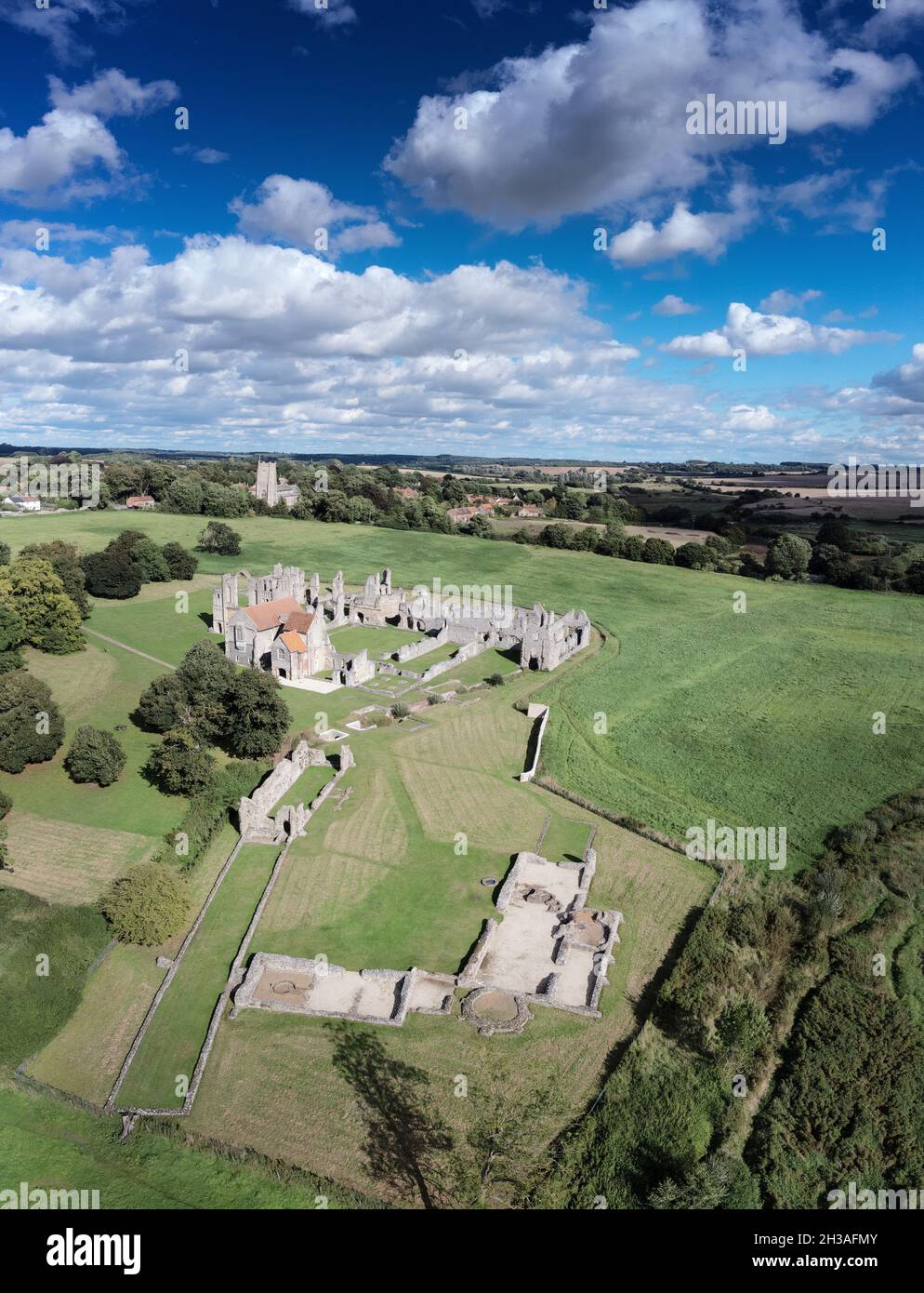 landscape image of the ruins of Castle Acre Priory a medieval building ...
