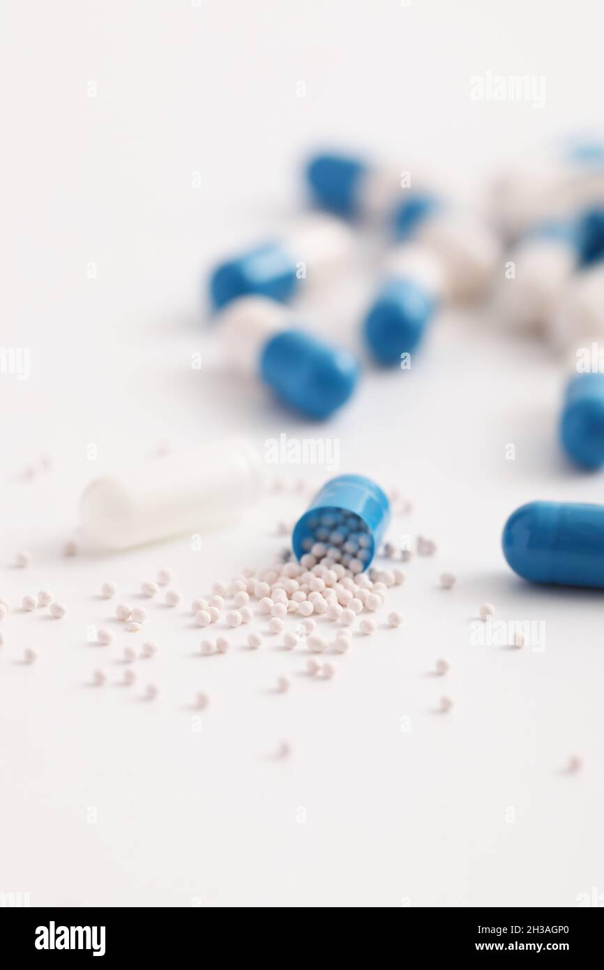 pills capsules close up isolated in white background Stock Photo - Alamy