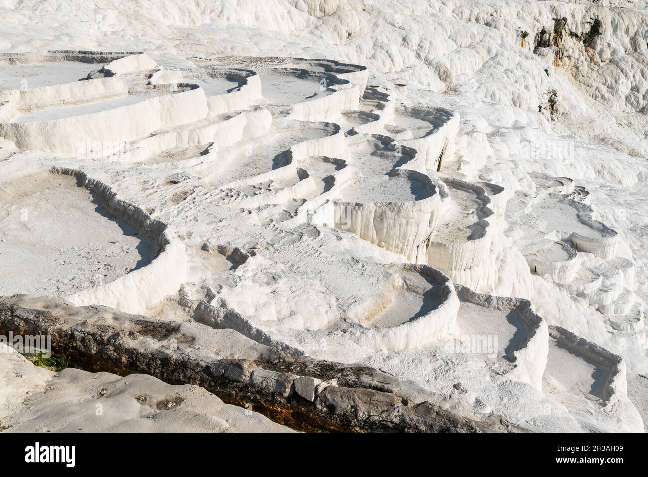 Travertine terrace formations in Pamukkale, Turkey. The area is famous ...