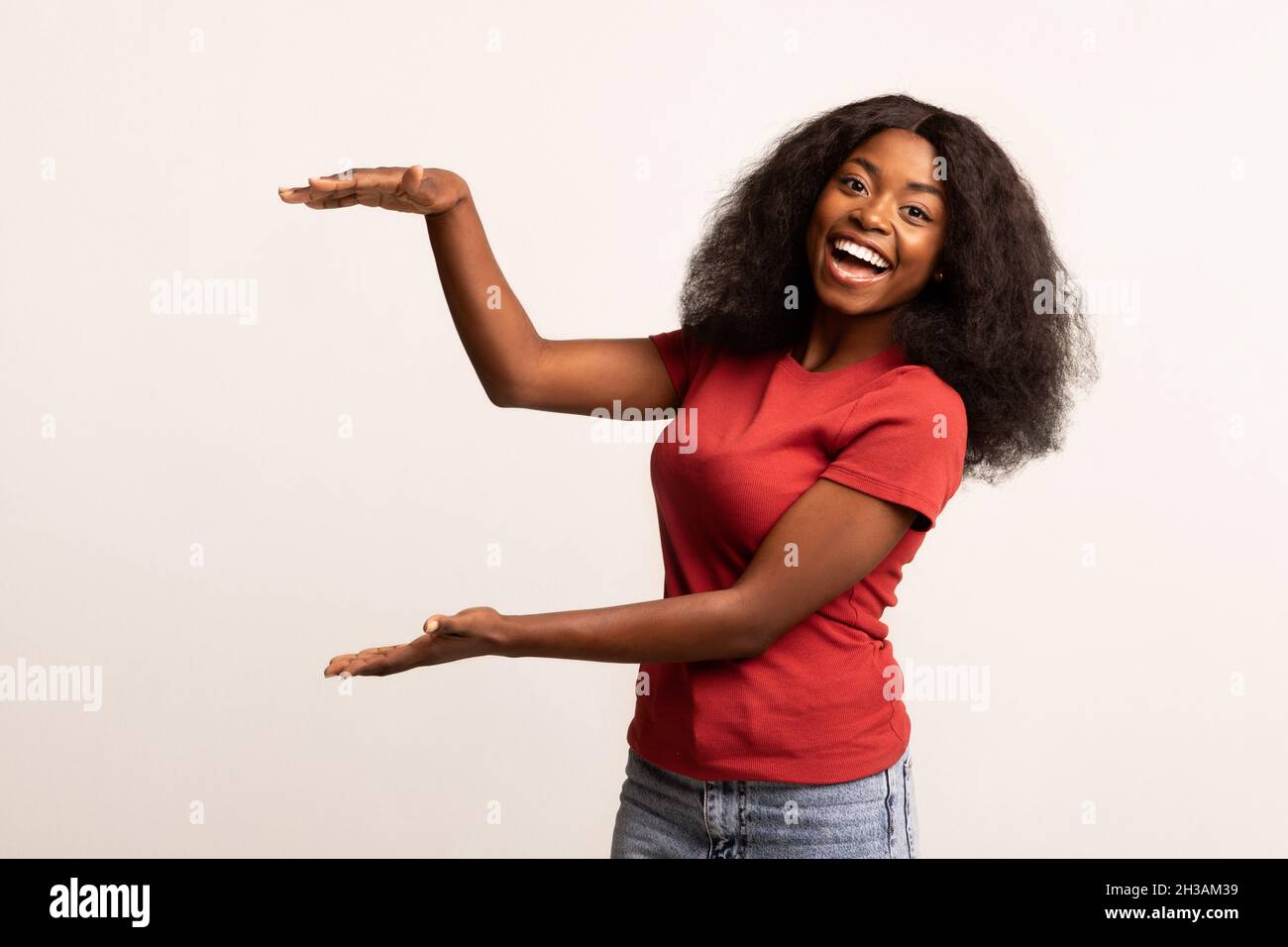Woman holding object both hands hi-res stock photography and images - Alamy