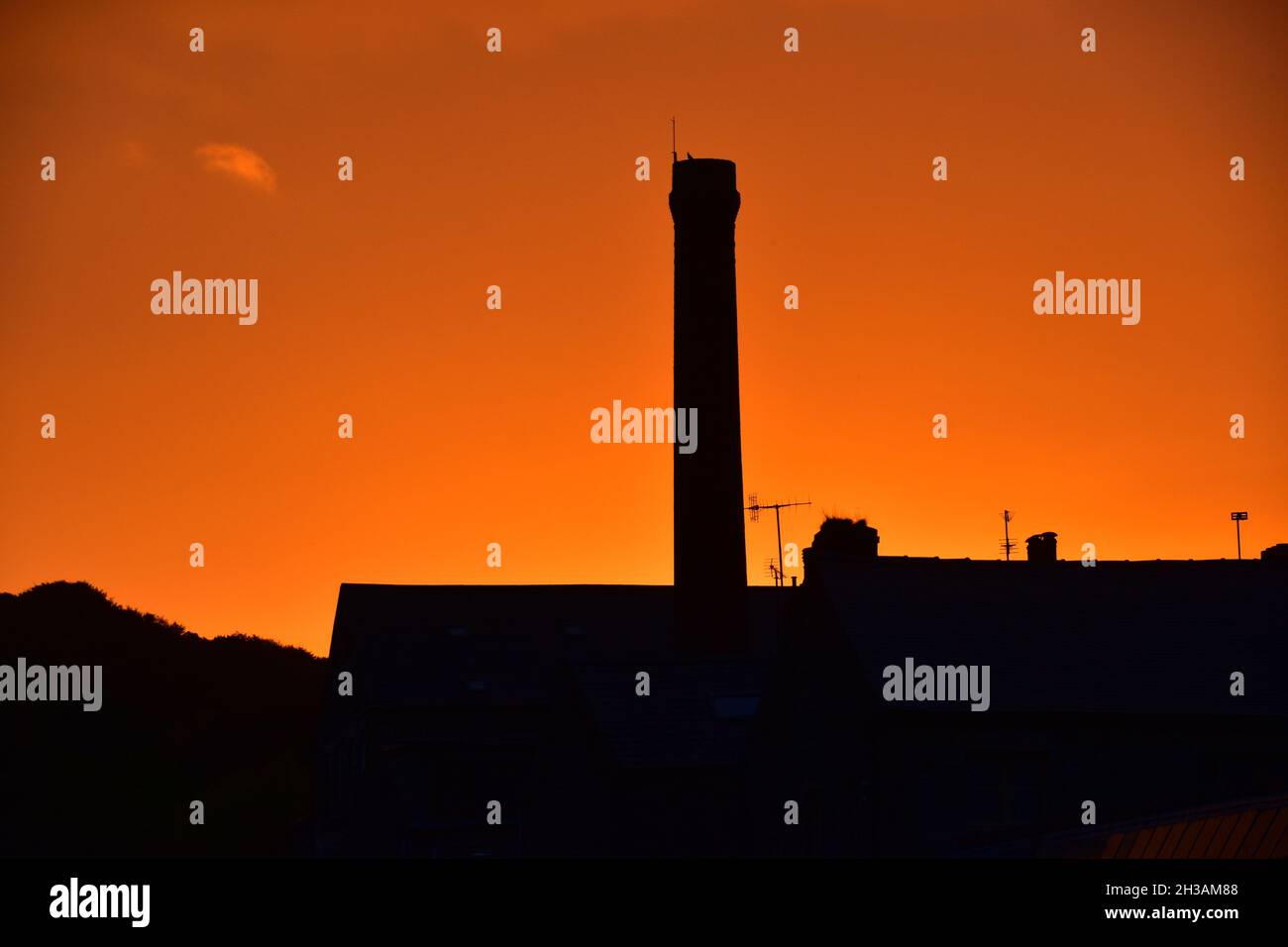 Mill Chimney silhouetted by sunrise, Hebden Bridge Stock Photo - Alamy