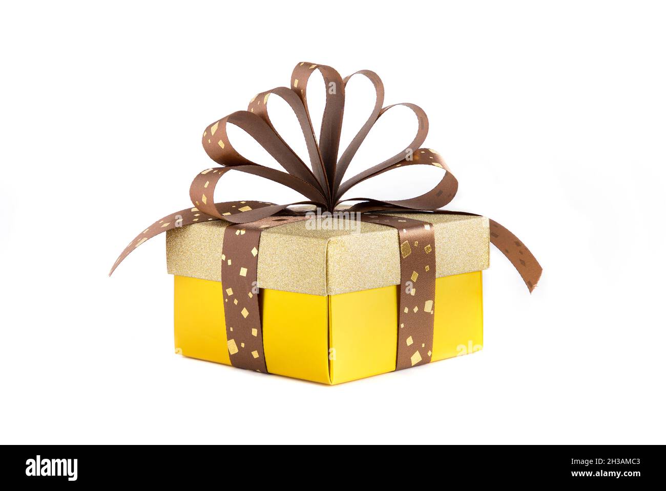 A beautiful gold color paper present box with brown and gold pattern ...