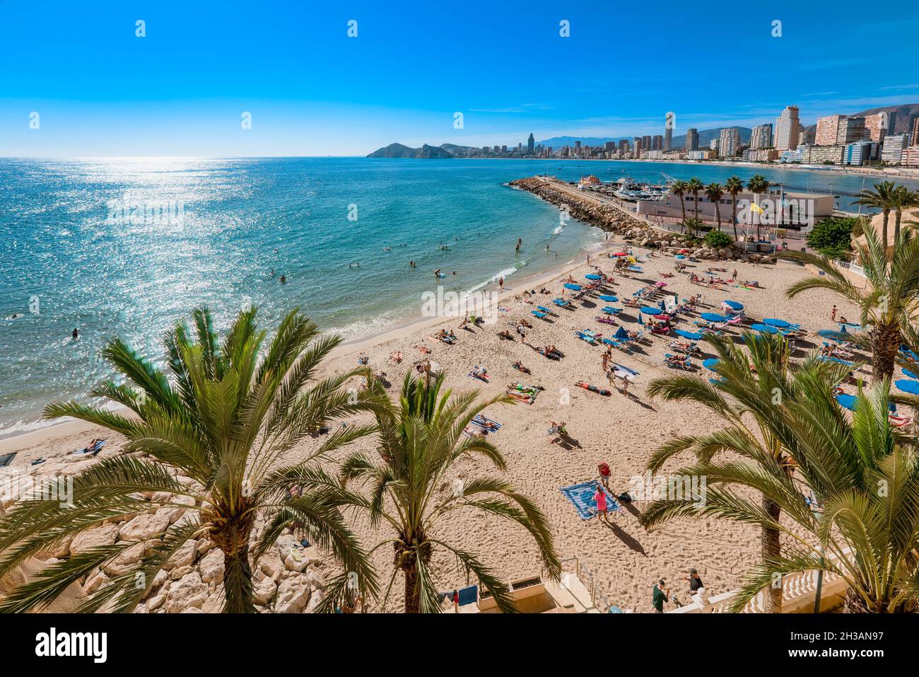 Tourists in Benidorm beach. Spanish resort city in the Mediterranean ...
