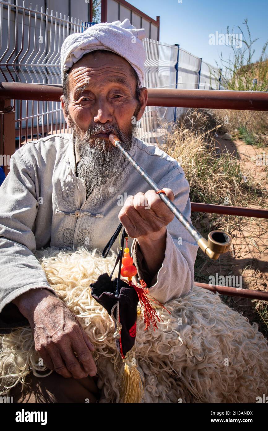 Elder Chinese man with turban at Jingbian, China Stock Photo - Alamy