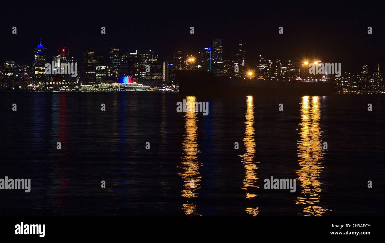 Stunning view of Burrard Inlet by night with illuminated skyline of ...