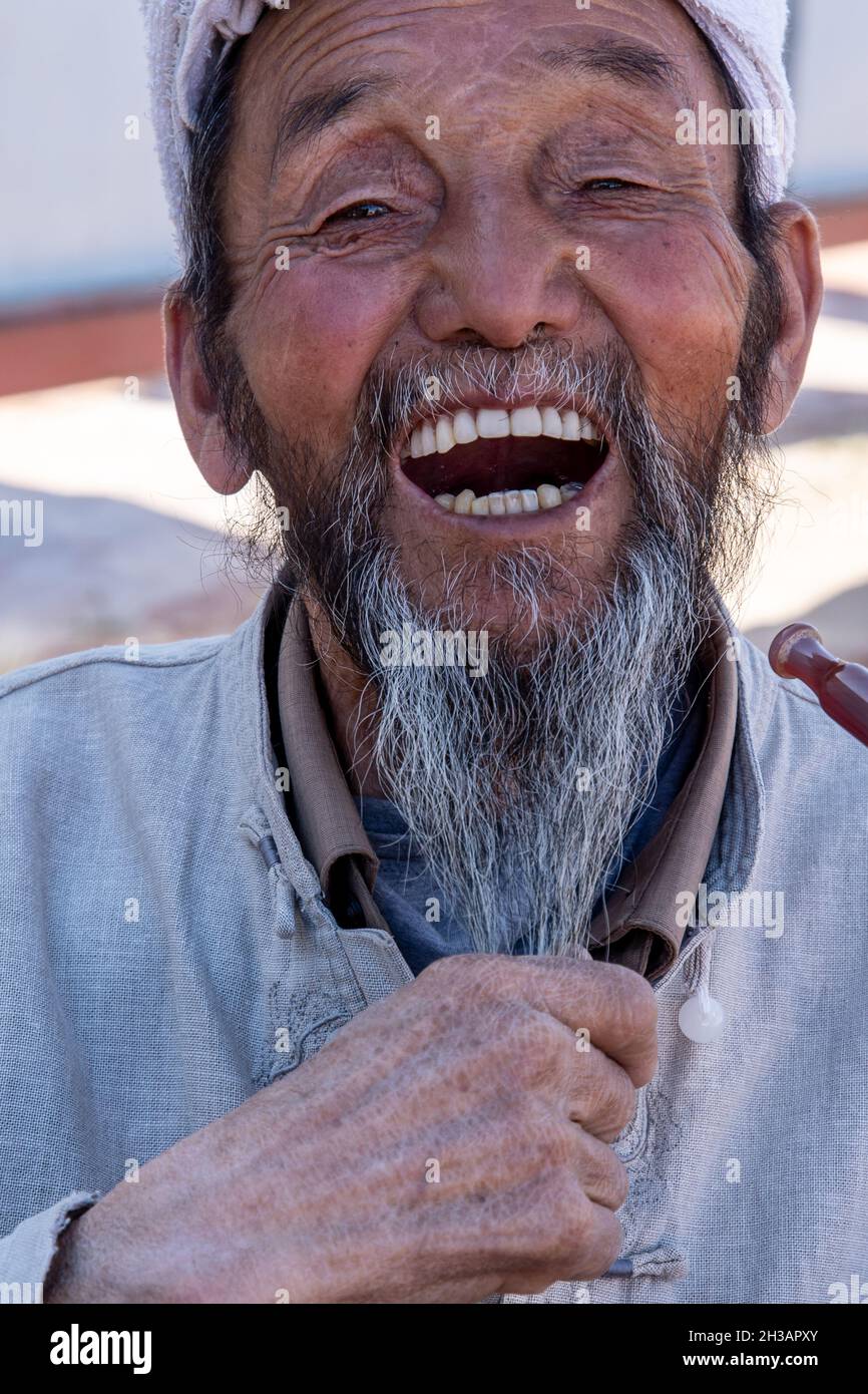 Elder Chinese man with turban at Jingbian, China Stock Photo - Alamy
