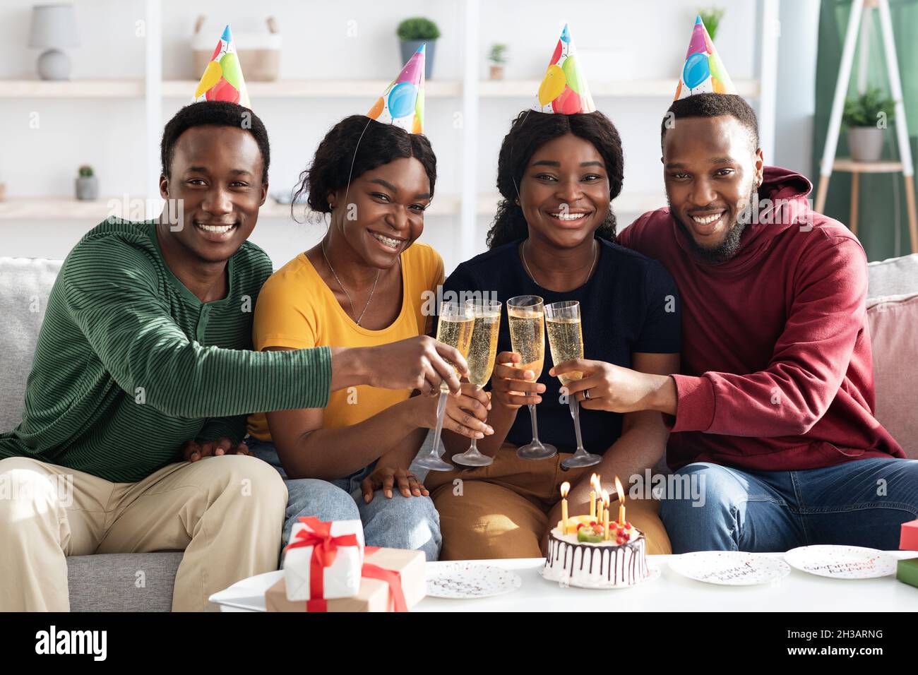 Beautiful african american millennials having birthday party Stock ...