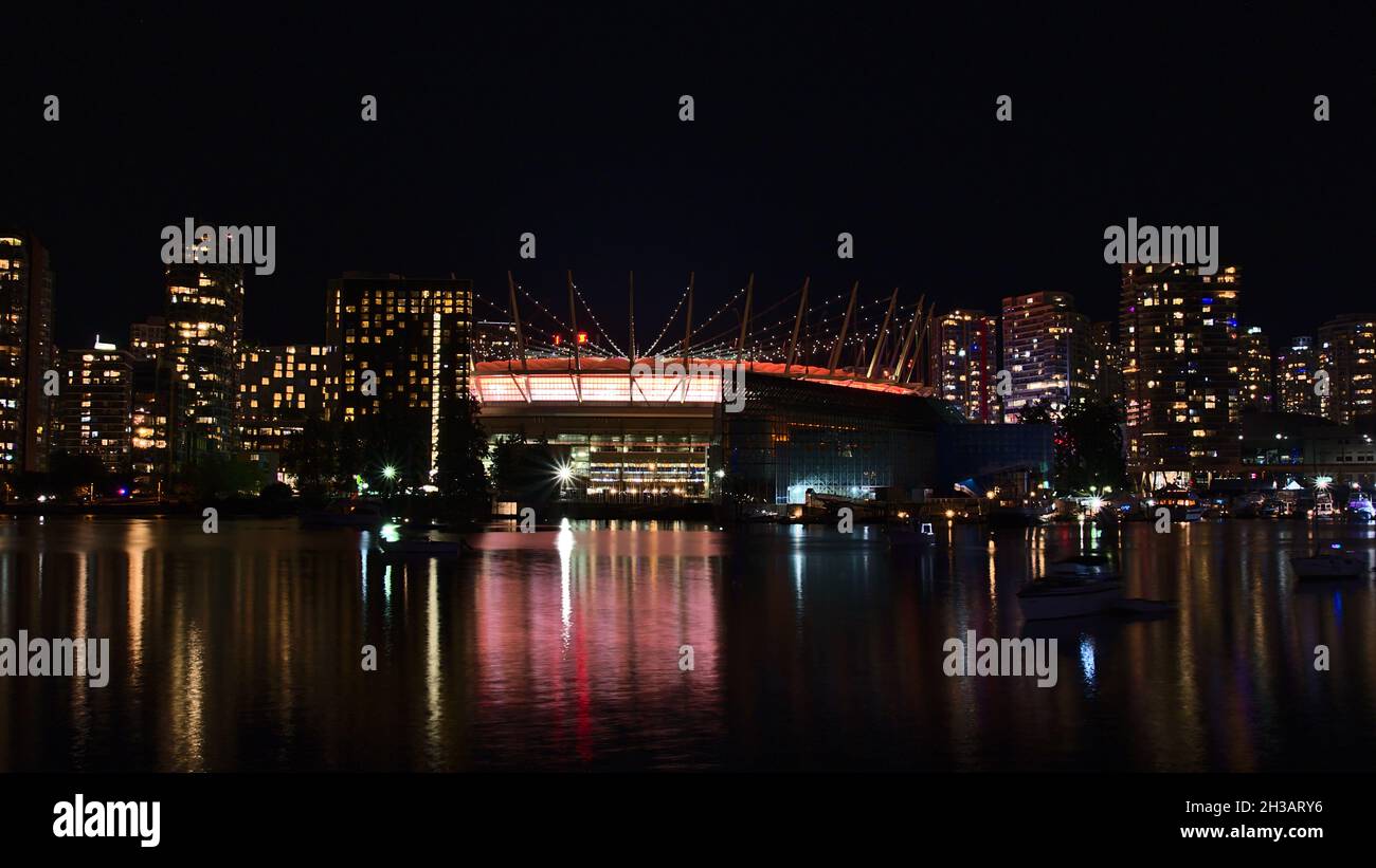 Beautiful view of False Creek bay, Vancouver downtown with red shimmer ...