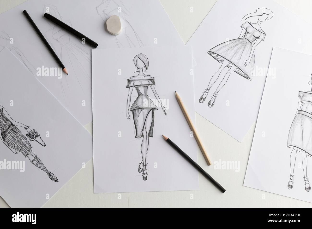 Sketches of women's clothing drawn on paper. Fashionable designer ...