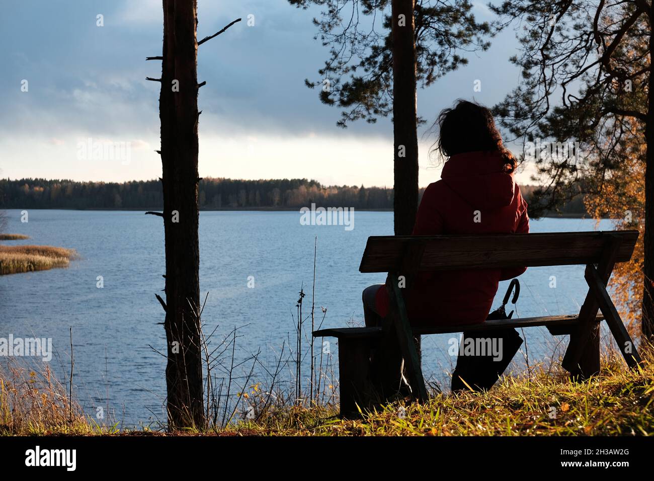 Person in red jacket hi-res stock photography and images - Alamy