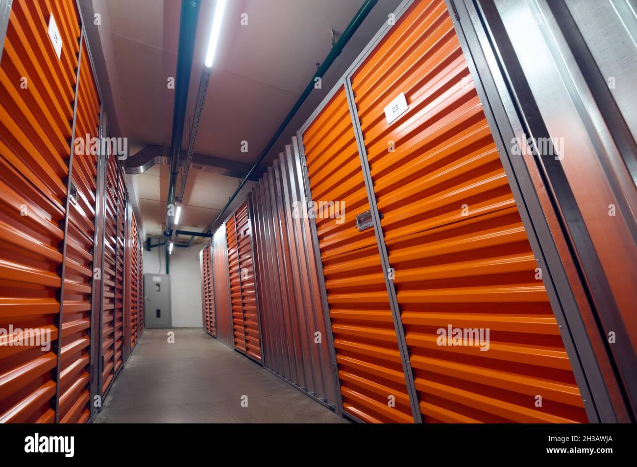Secure closed garage storage compartments in warehouse Stock Photo - Alamy