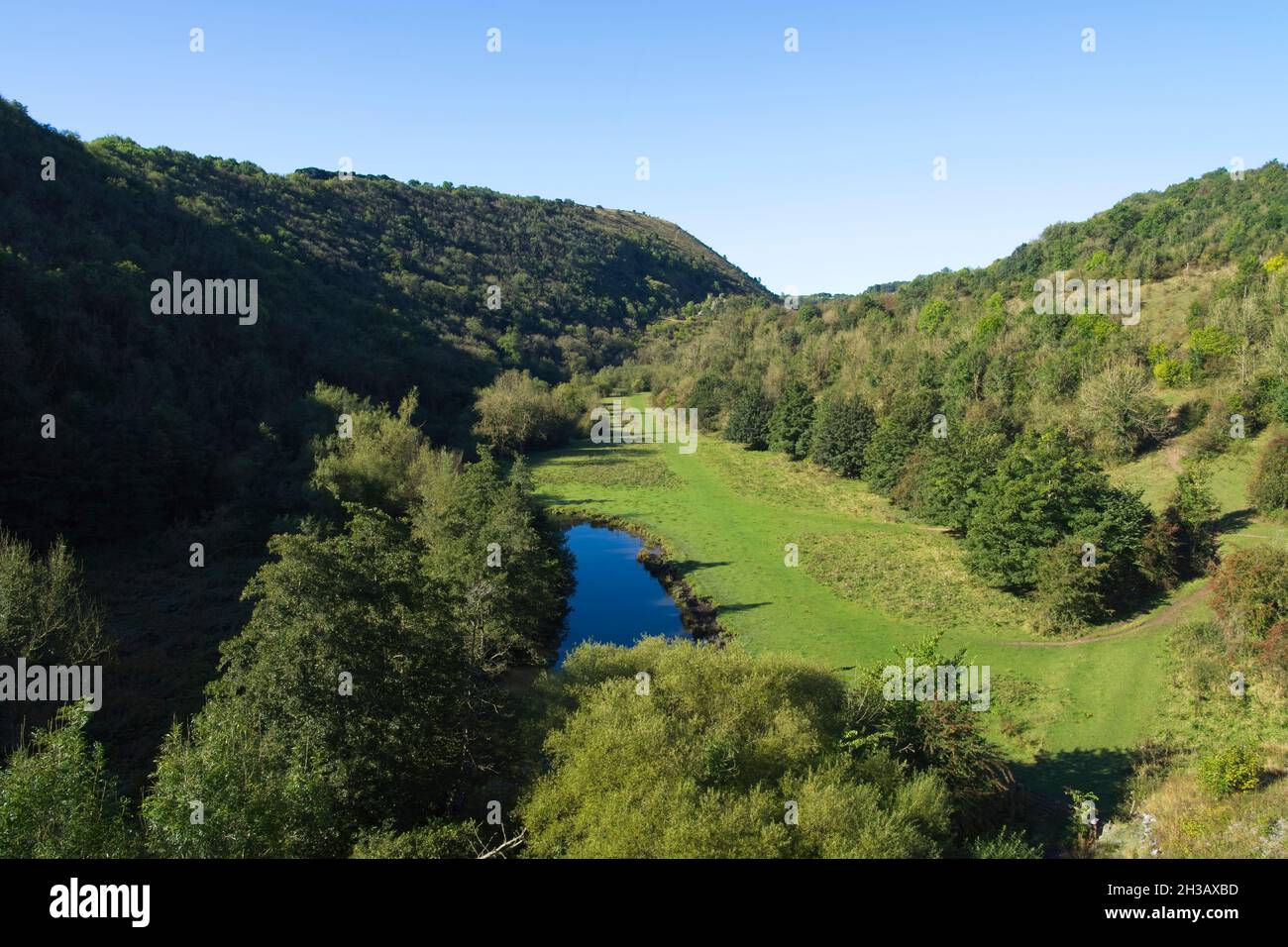 Looking over the tops of trees down the deep valley of Monsal Dale in ...