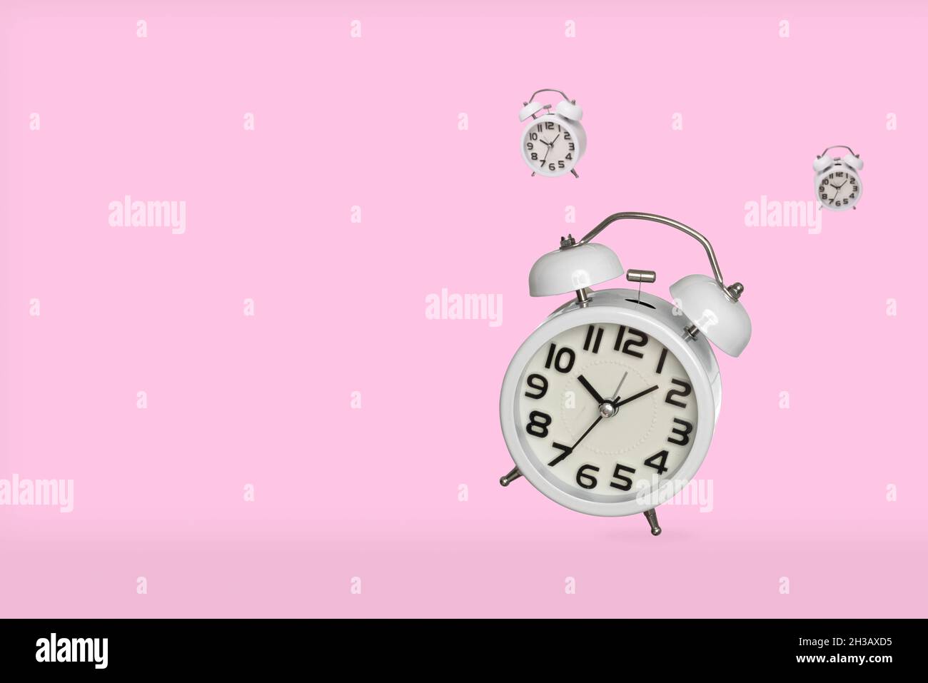 Alarm clocks isolated on pink background with copy space Stock Photo ...