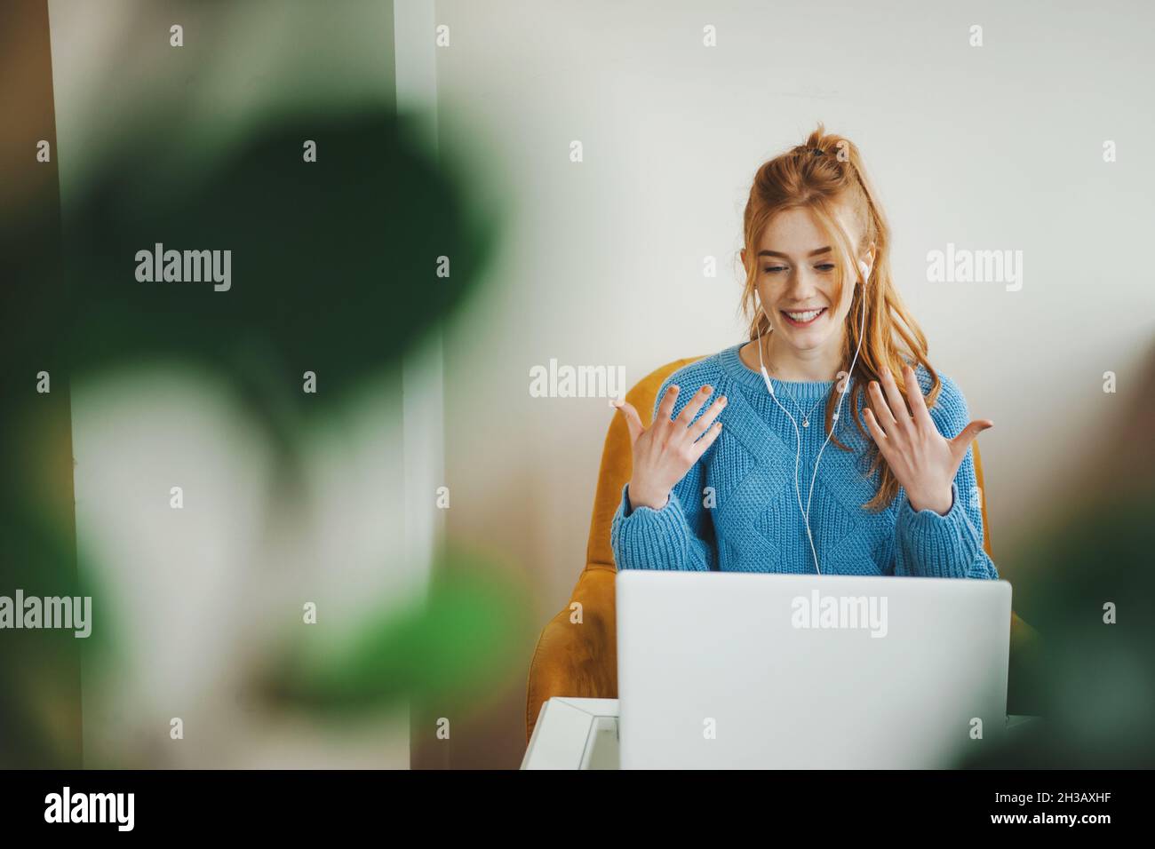 Front view of a woman actively participating in an online interview ...