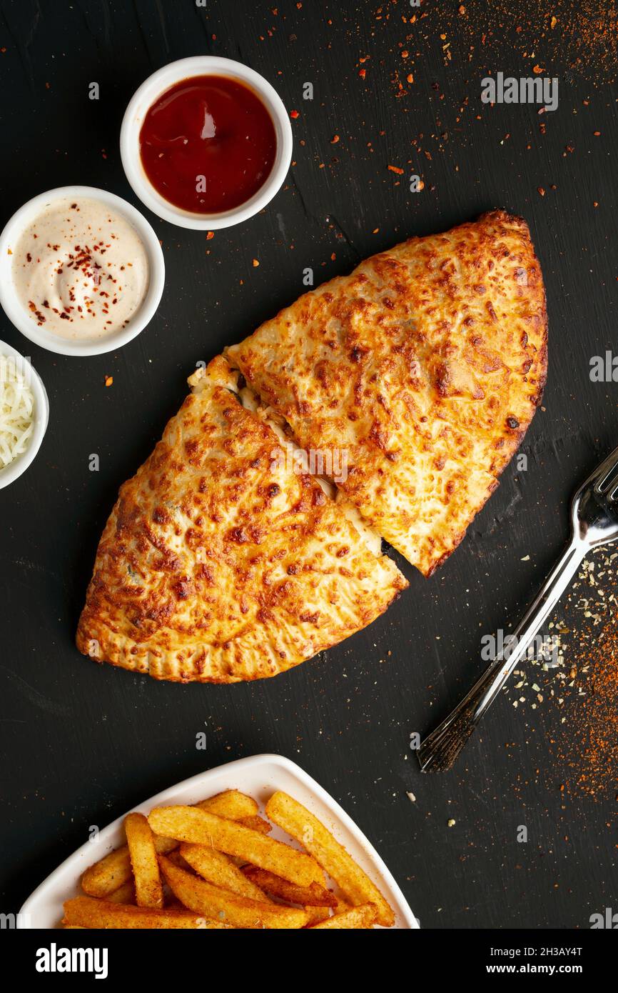 Italian calzone with cheese Stock Photo - Alamy