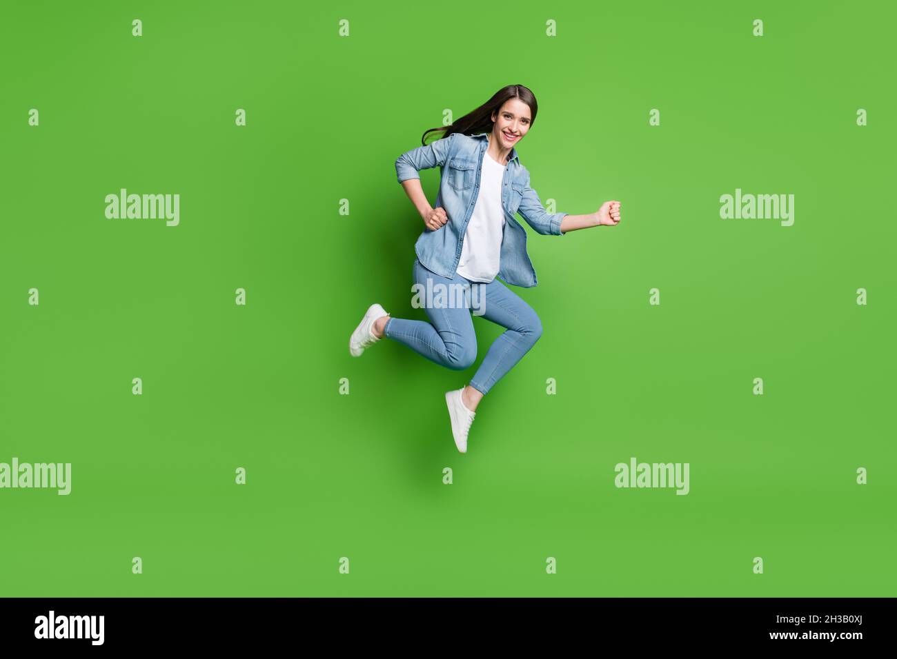 Full length body size view of attractive cheerful girl jumping running ...