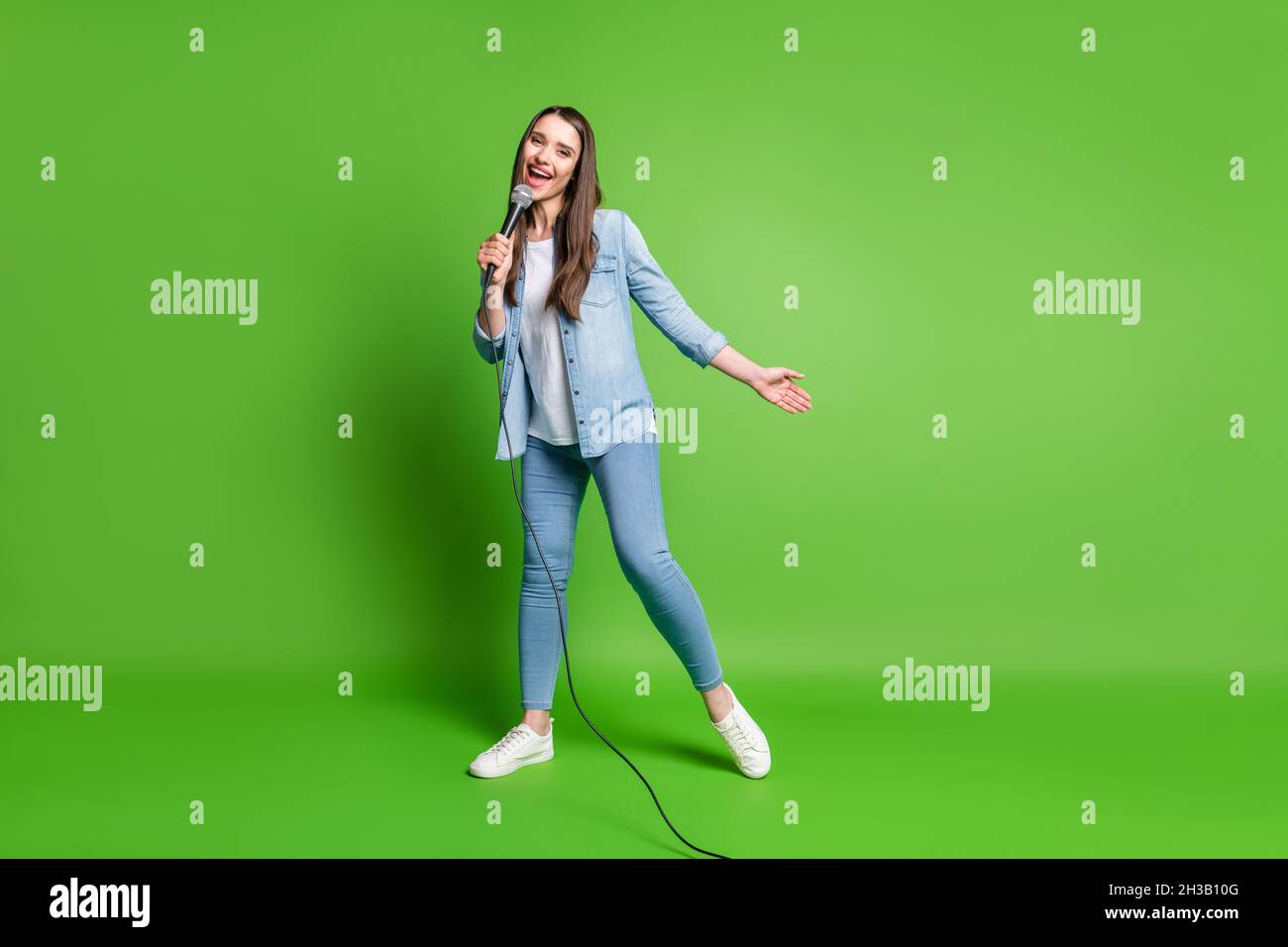 Full length body size view of attractive cheerful girl singing jazz ...