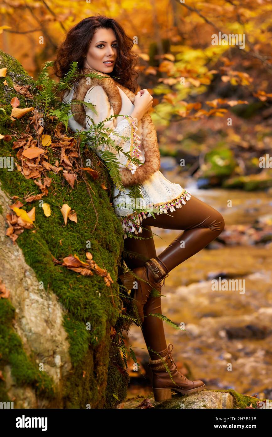 Autumn portrait with a beautiful woman in different positions near a ...
