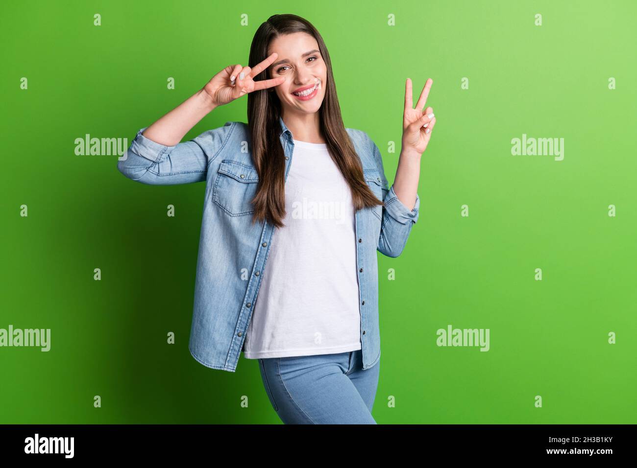 Portrait of attractive cheerful funky girl showing double v-sign having ...