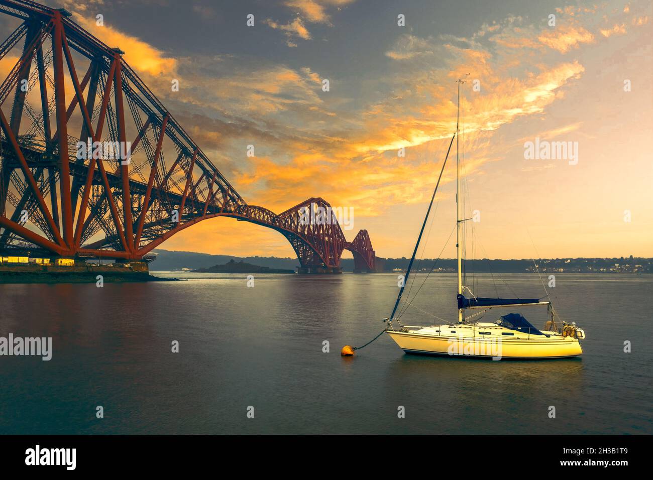 Beautiful scenery of a Sail boat on the river with Forth bridge ...