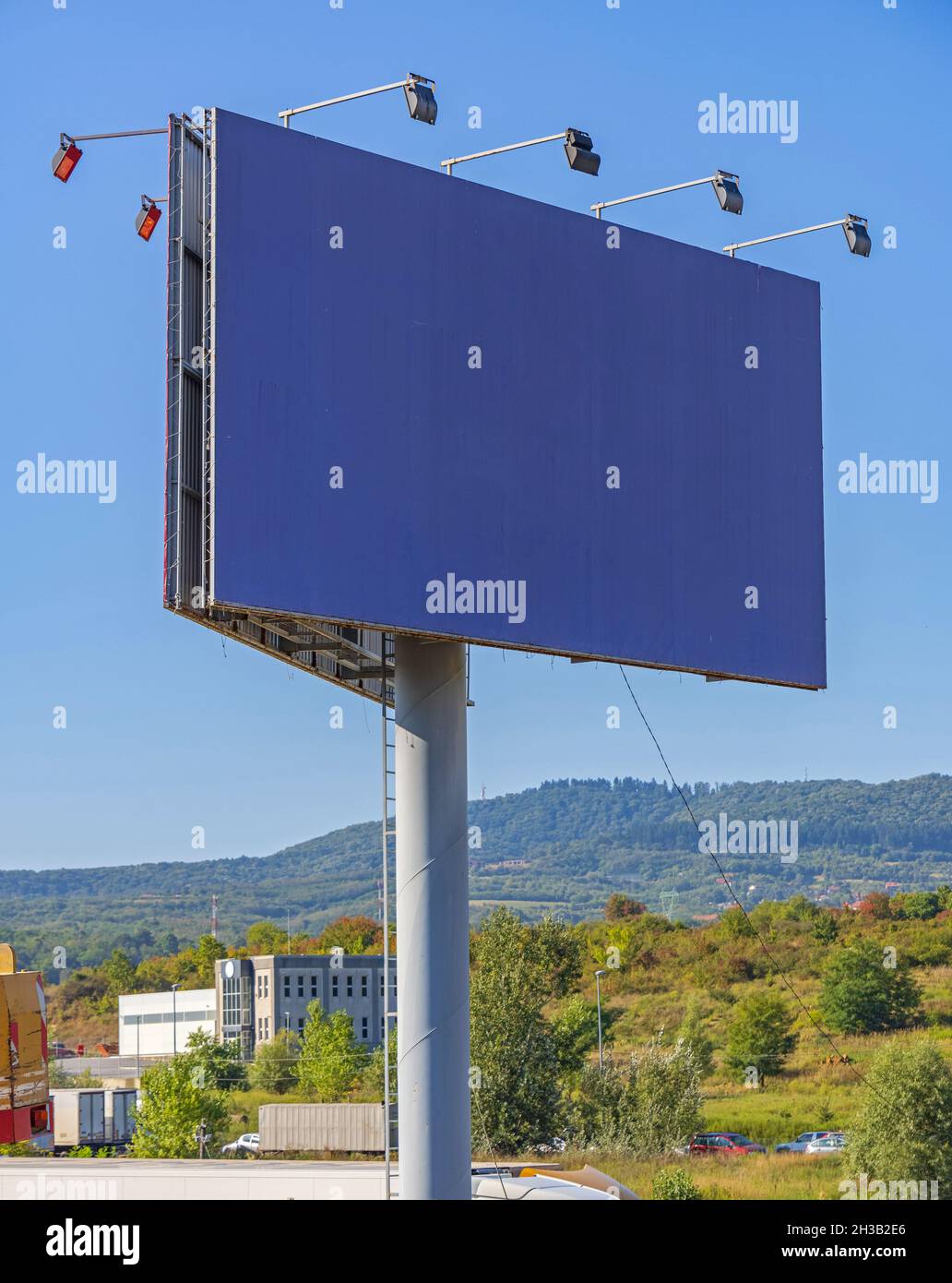 Big Blue Empty Space Billboard With Reflectors at Pole Stock Photo - Alamy