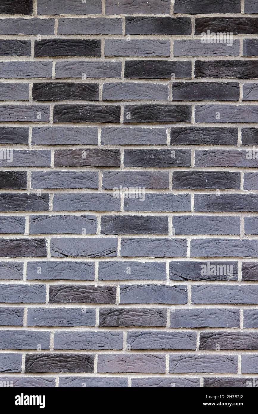 Grey and Black Bricks Building Wall Exterior Background Stock Photo - Alamy