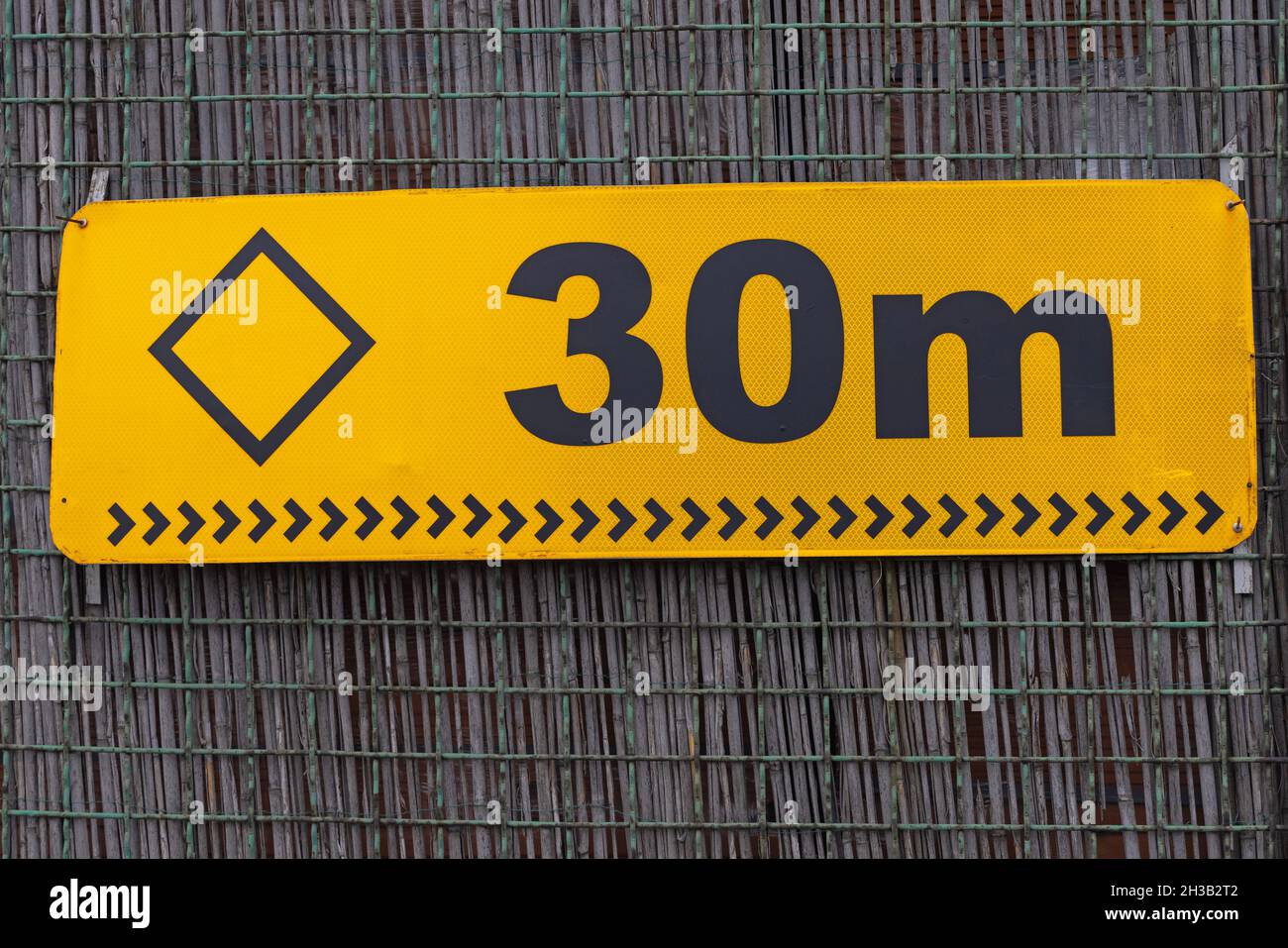 Thirty Meters Yellow Reflective Sign Arrows Stock Photo - Alamy