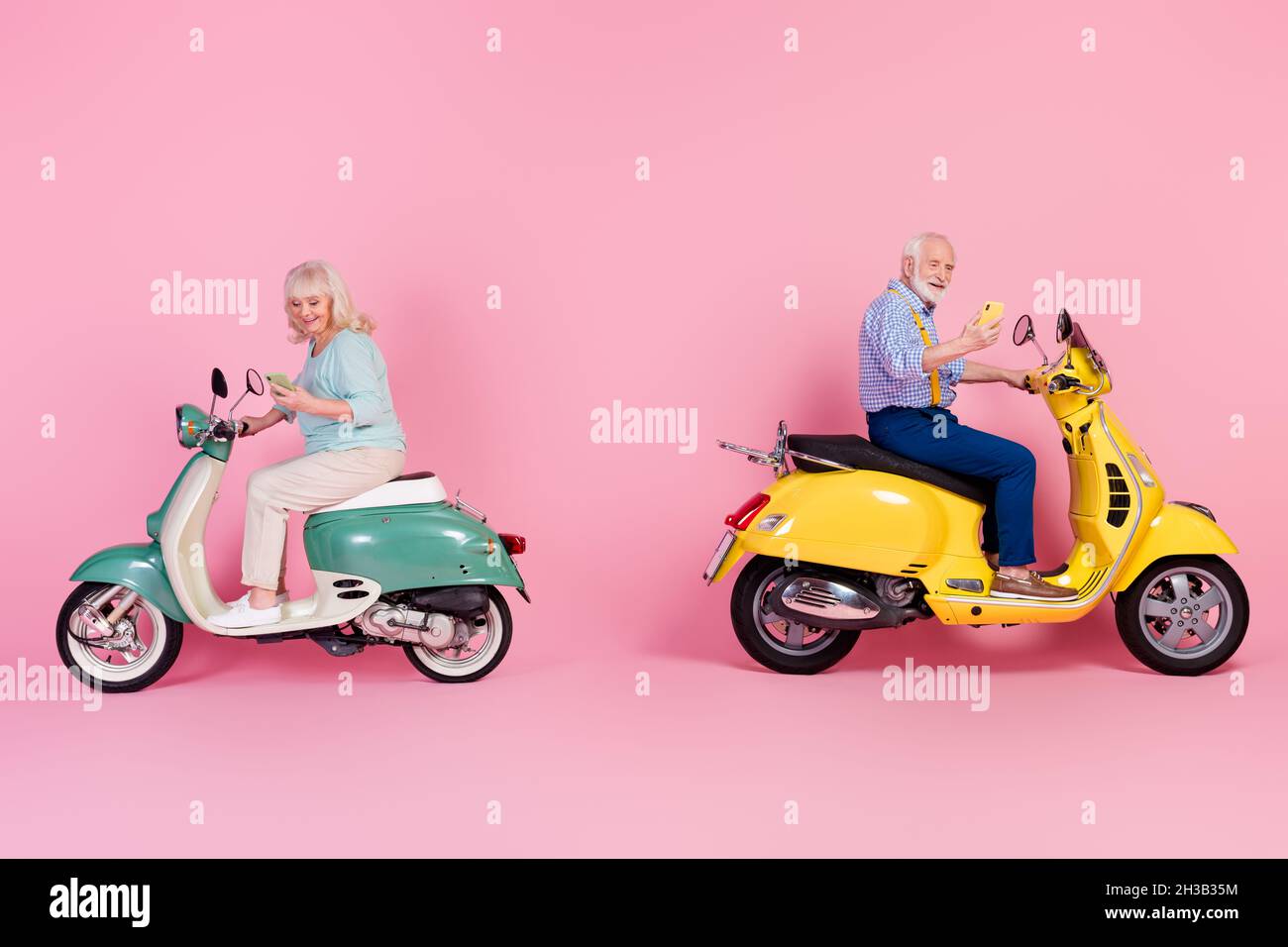 Full size profile side photo of two people models ride drive moped wear ...