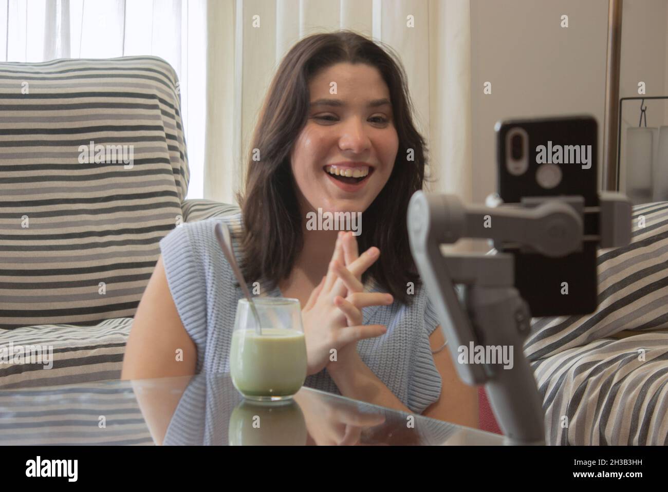 Young girl with a surprised face after receiving surprise news from her ...