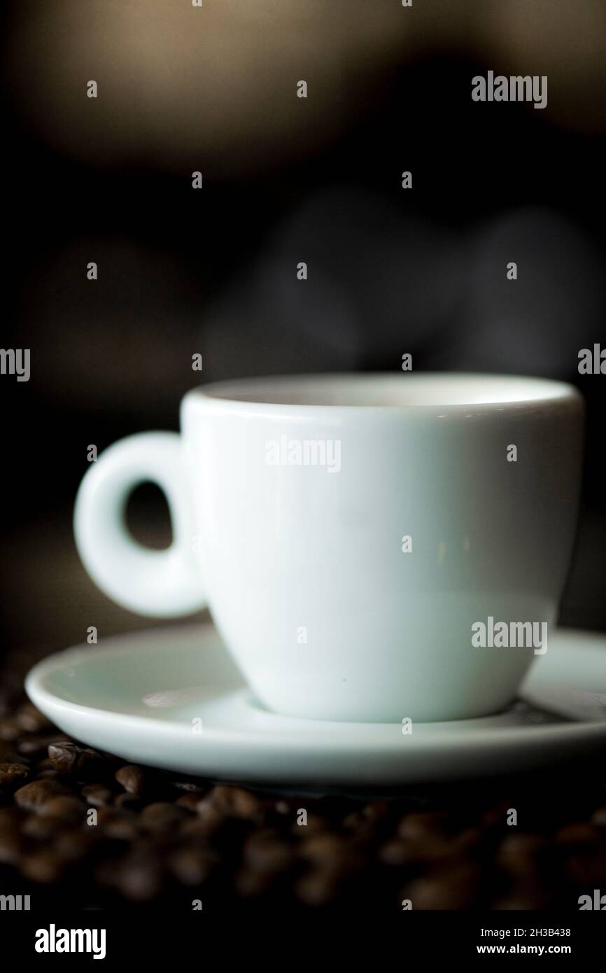 Coffee cup and coffee beans at a coffee shop. Still details. High ...