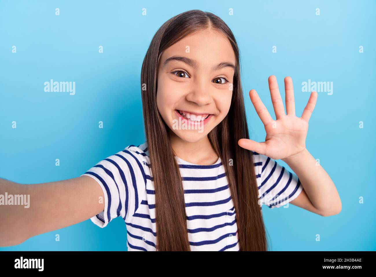 Photo of young attractive girl happy positive smile shoot selfie wave ...