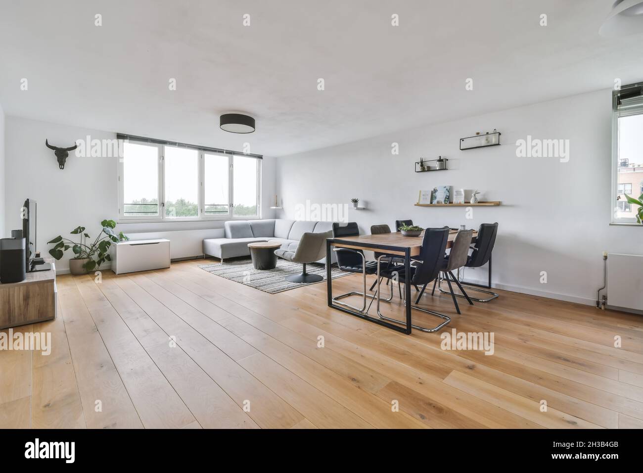 Modern room design with living, dining and office set Stock Photo - Alamy