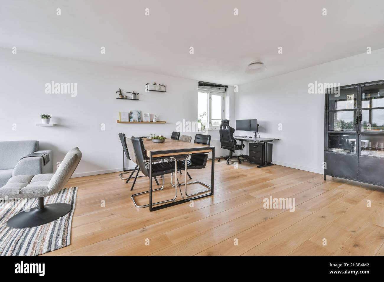 Modern room design with living, dining and office set Stock Photo - Alamy