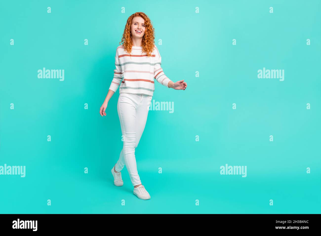 Full length body size view of pretty thin cheerful girl walking ...