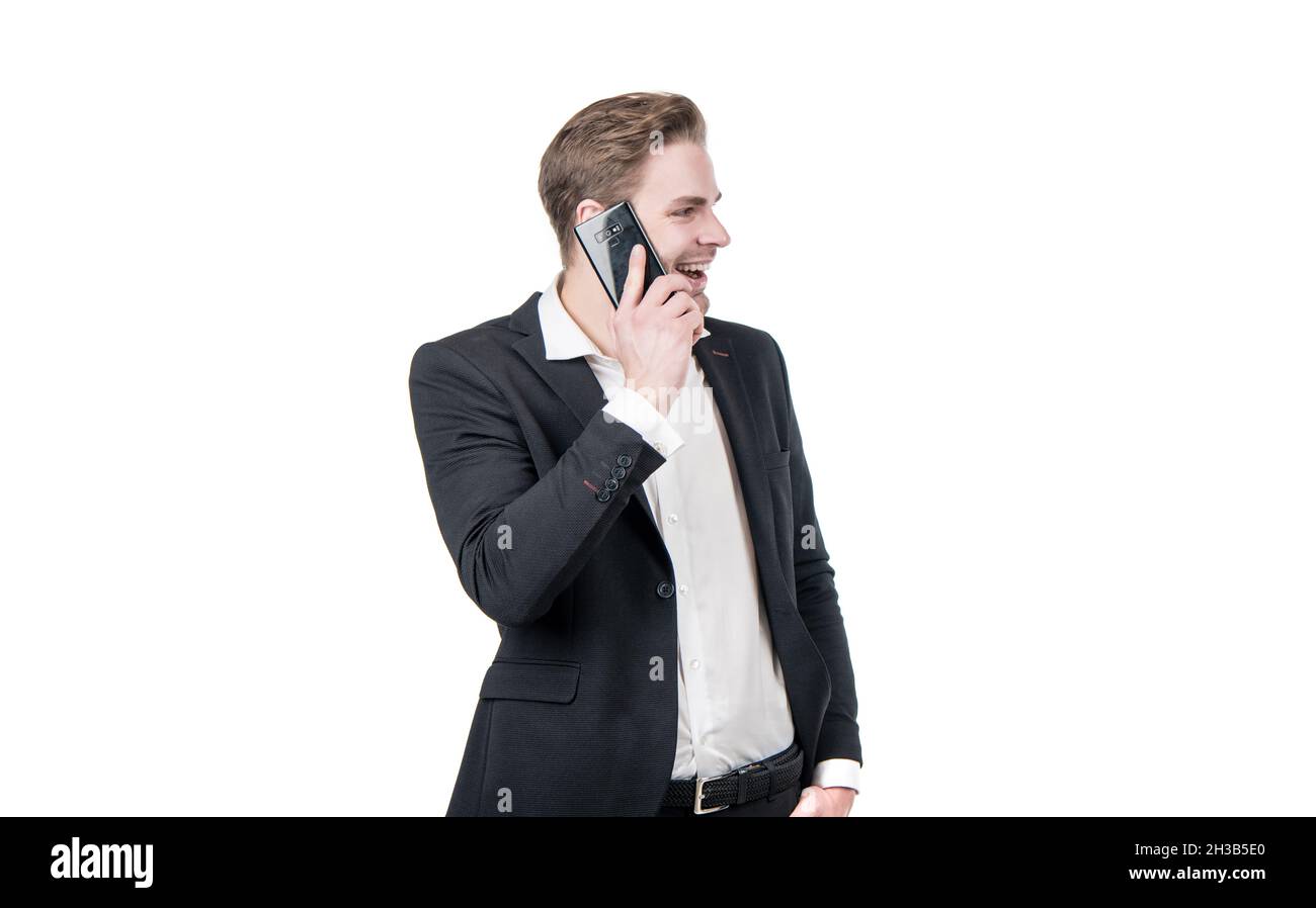 Happy business professional man in formalwear talk on mobile phone ...