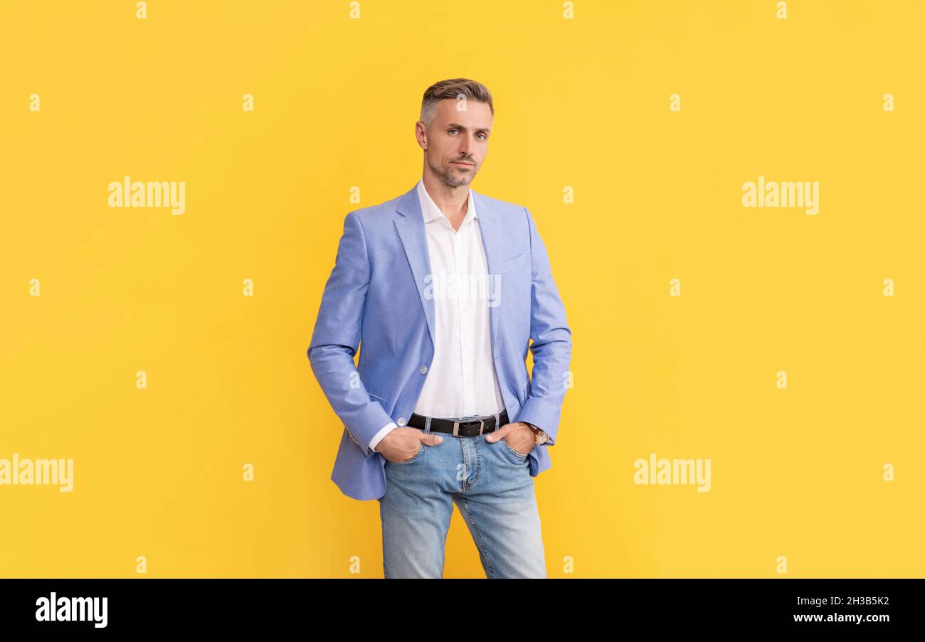 successful man in businesslike suit. manager executive on yellow ...