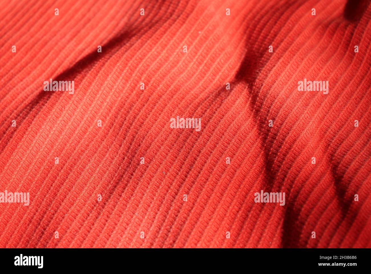 Red material background. Vivid red cloth background Stock Photo - Alamy