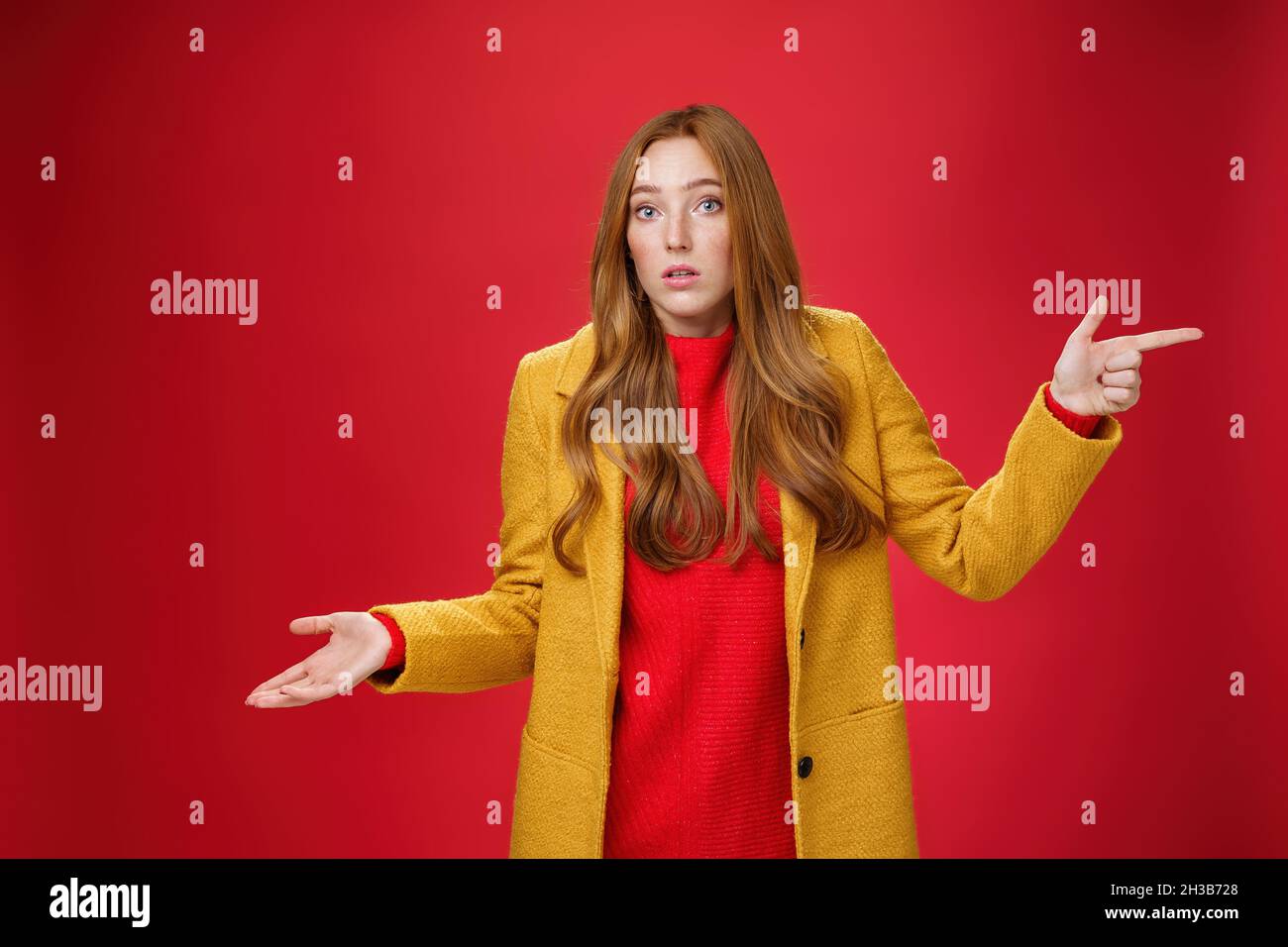Woman missed client posing confused and unaware how happened shrugging ...