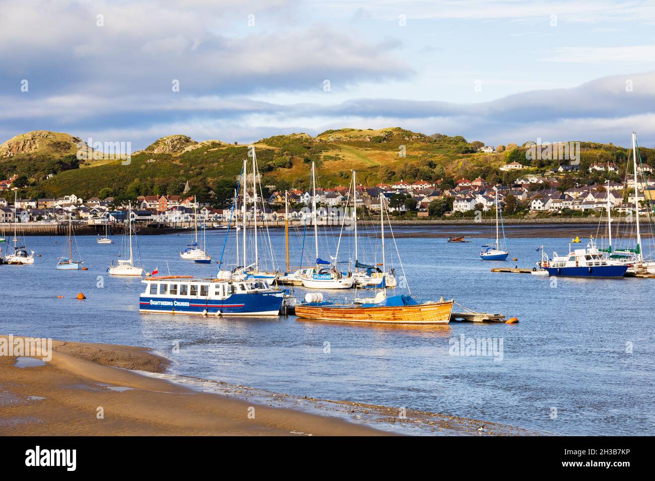 Small boats anchored in the River Conwy estuary, Conwy, Glwyd, Wales ...