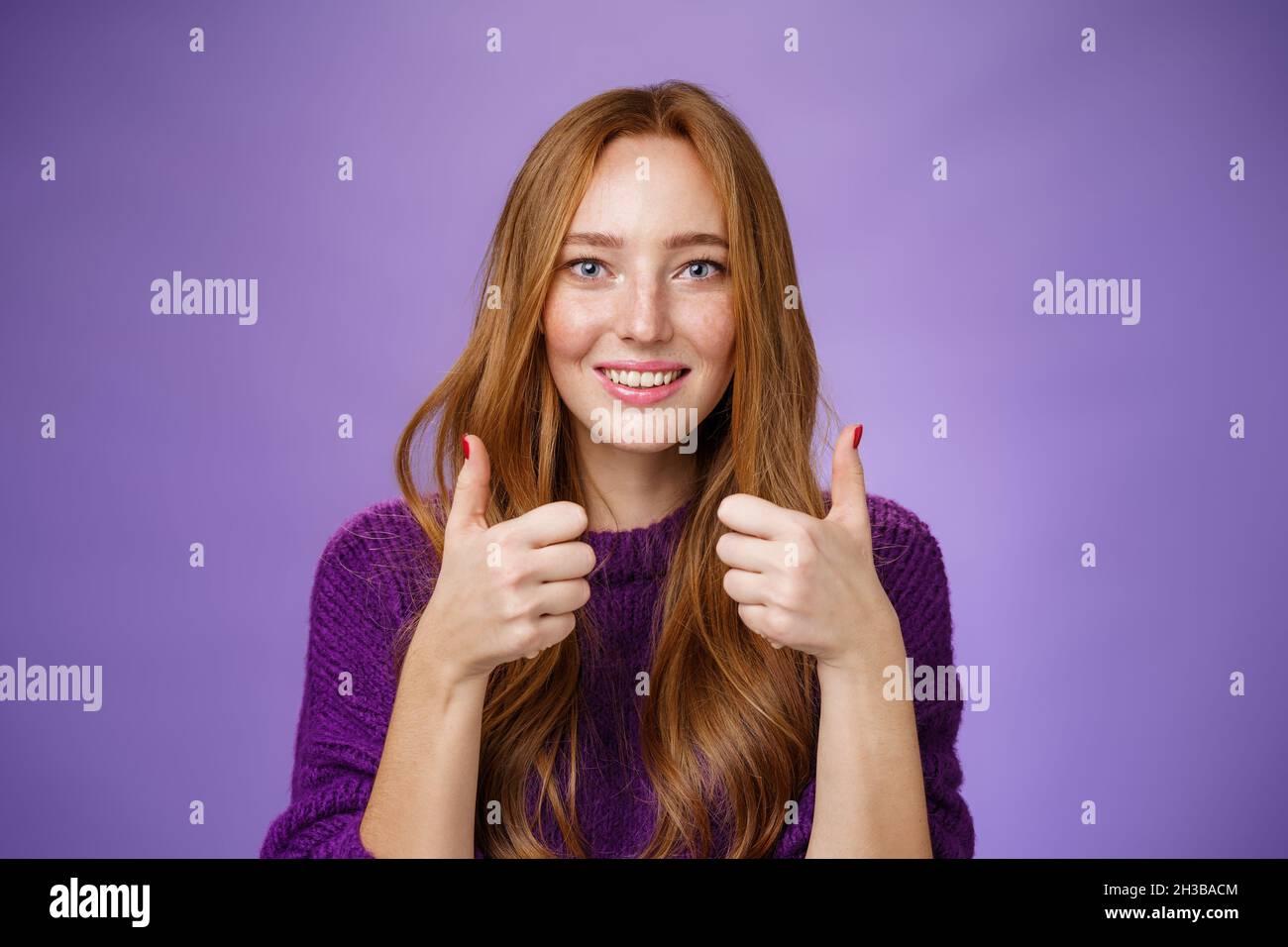 Impressed girl admiring great music taste of friend showing thumbs up ...