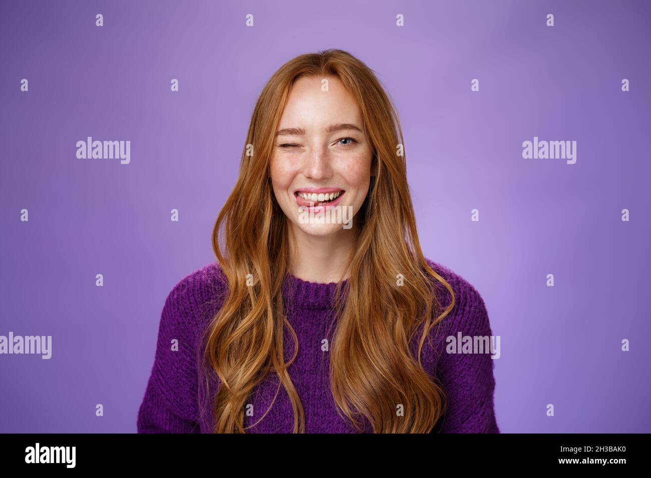 Close-up shot of sincere and happy funny cute redhead female with long ...