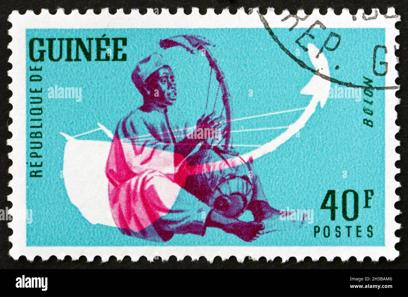 GUINEA - CIRCA 1962: a stamp printed in Guinea shows Bolon Player ...