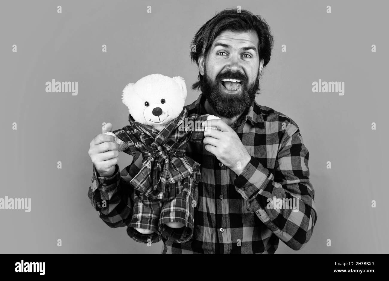 With her fathers teddy Black and White Stock Photos & Images - Alamy