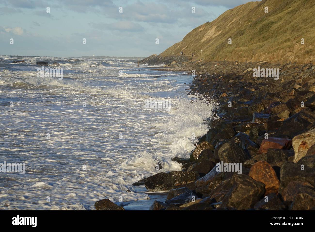 Hiking the coastal path of Lonstrup on a sunny and stormy day ...