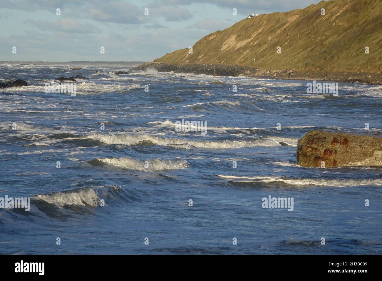 Hiking the coastal path of Lonstrup on a sunny and stormy day ...