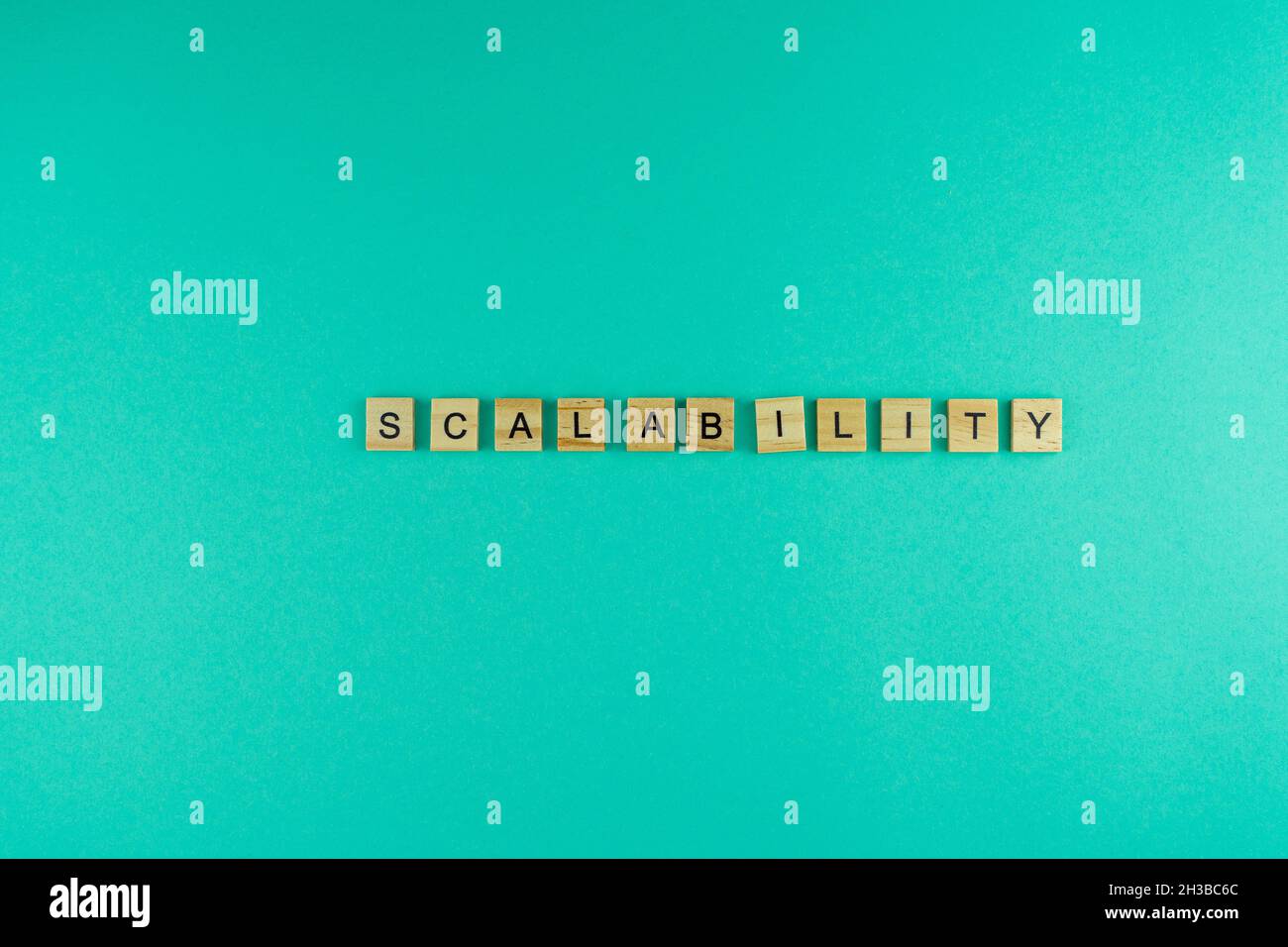 Word scalability. The phrase is laid out in wooden letters. Top view ...