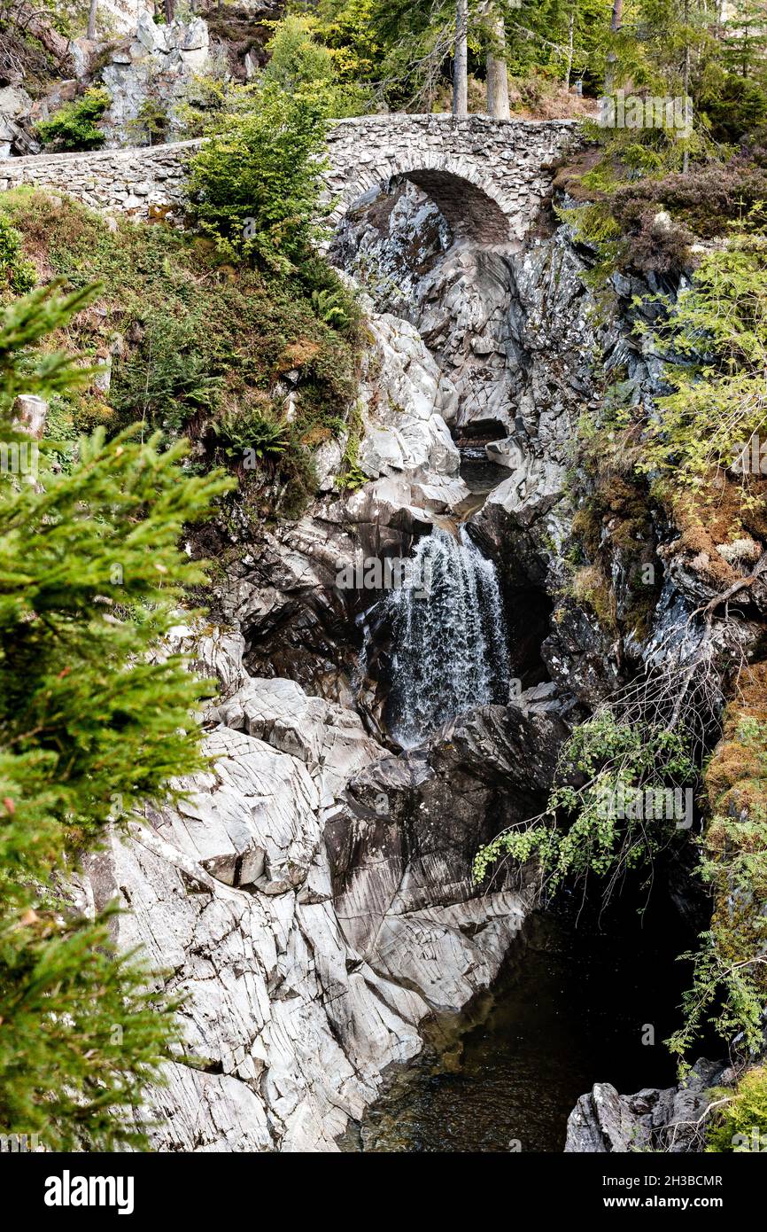 Waterfall beneath old stone bridge Stock Photo - Alamy