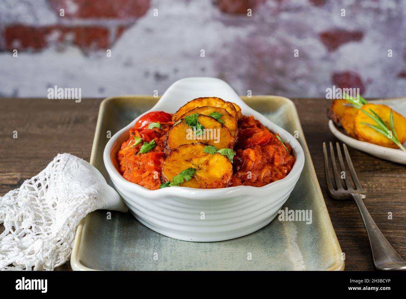 Jollof rice with deep fried plantain - spicy vegetarian African rice ...